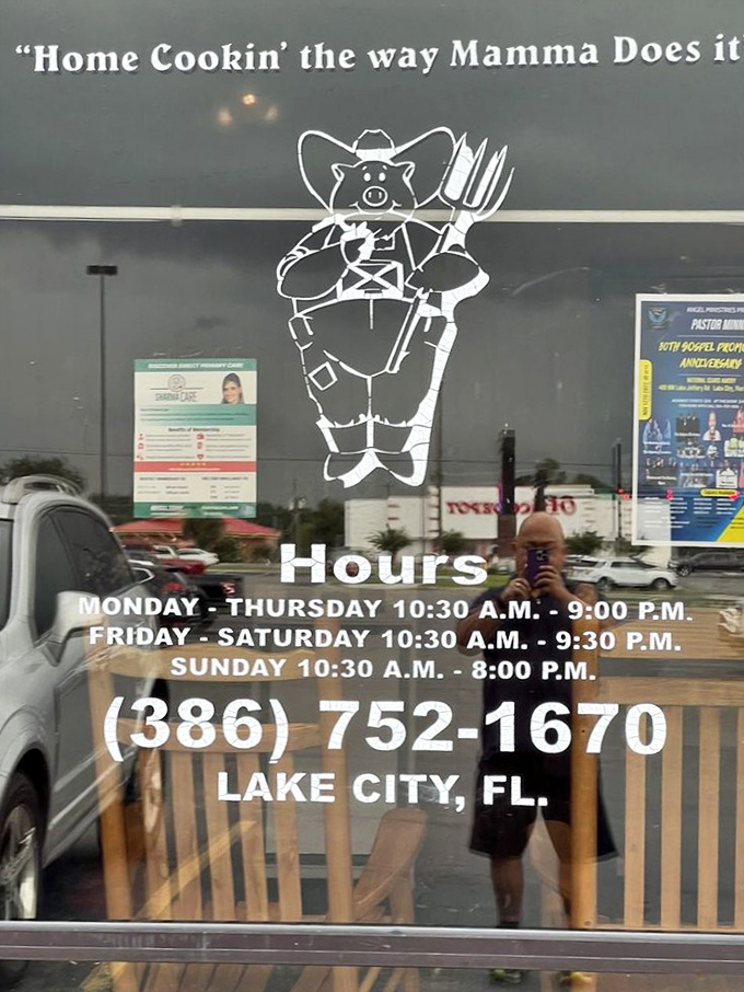 "Home Cookin' the way Mamma Does it"—the restaurant's window promises, alongside a pig mascot who seems suspiciously cheerful given the circumstances.