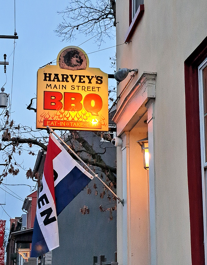 The glowing sign serves as a lighthouse for the barbecue-starved, promising salvation in the form of smoked meats ahead.