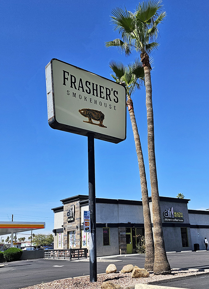 Palm trees frame the Frasher's sign&mdash;a uniquely Arizona take on BBQ paradise. Desert heat meets smoker heat in perfect harmony.