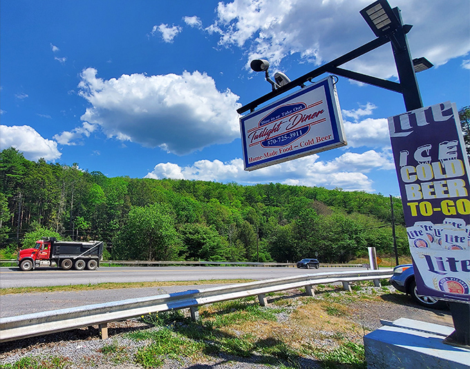 The roadside sign standing proud against Pennsylvania's green hills, beckoning hungry travelers like a lighthouse for empty stomachs.