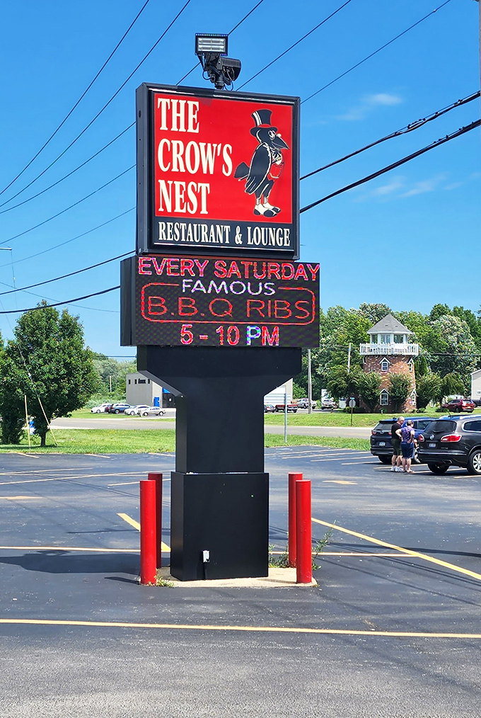 The roadside sign announces Saturday BBQ ribs like a Vegas marquee, promising weekend delights that locals plan their schedules around.