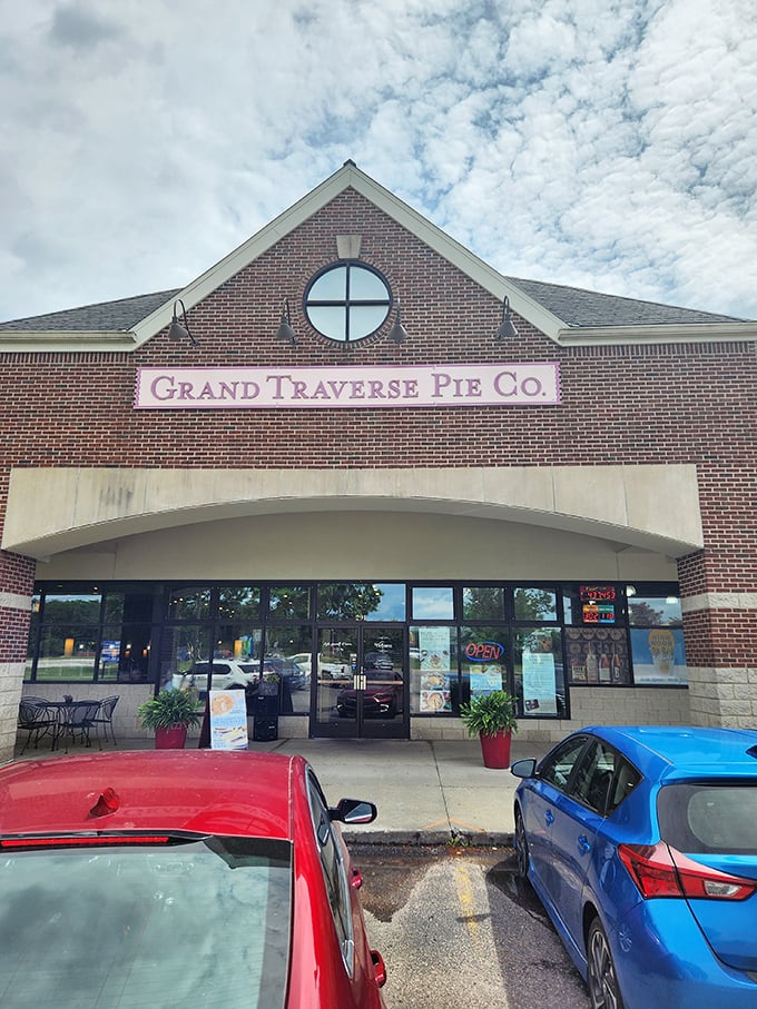 The distinctive roofline and circular window have become a beacon for pie pilgrims. Cars in the lot represent people making excellent life choices.