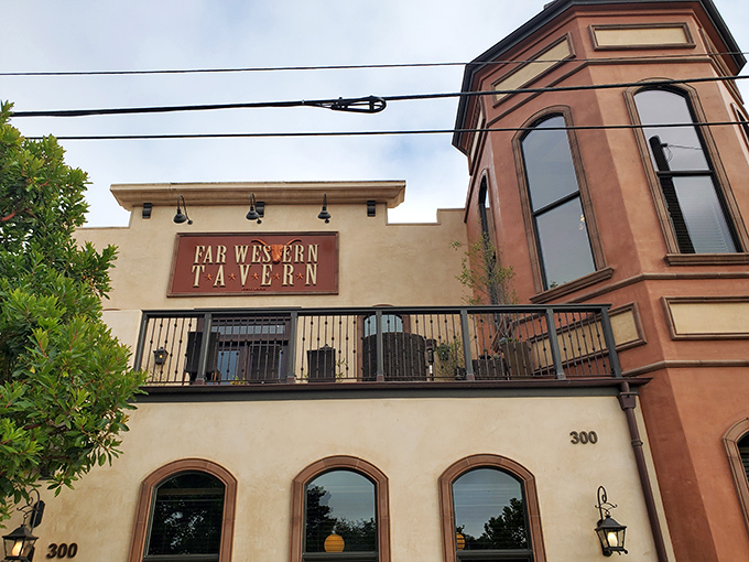 The restaurant's distinctive silhouette against the California sky. That balcony isn't just architectural flair&mdash;it's where food dreams and fresh air collide.