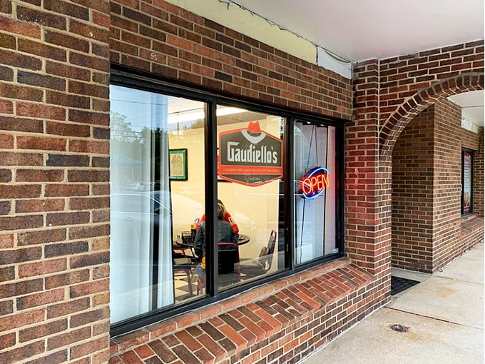 A glimpse through the window reveals Gaudiello's welcoming brick exterior – like peeking into a sandwich sanctuary where hoagie dreams come true.