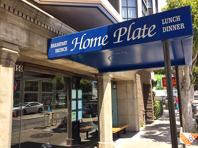 Sunshine bathes the Home Plate storefront, as if the universe is highlighting exactly where you should be eating breakfast today.