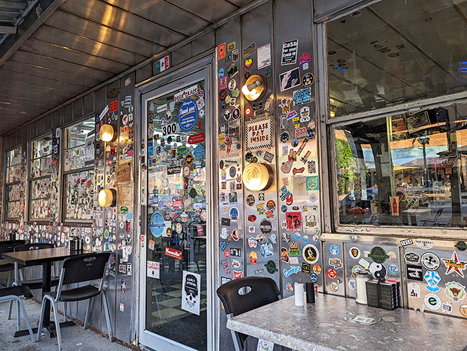 Every sticker on these windows represents a visitor who found something worth remembering&mdash;creating a collective memory wall of satisfied appetites and good times.