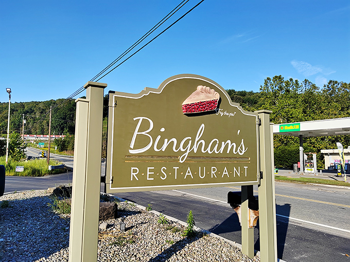 The sign says "Bingham's Restaurant" but might as well read "Your diet ends here" &ndash; complete with a slice of pie that's practically winking at you.