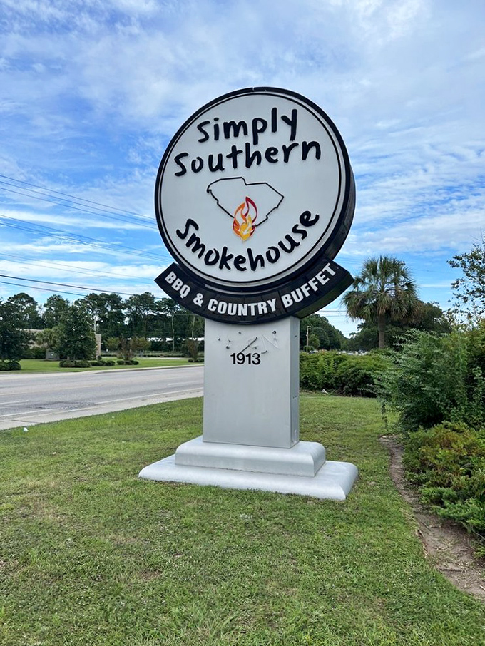 The restaurant's sign proudly displays South Carolina's silhouette with a flame&mdash;a beacon for hungry travelers seeking authentic Southern comfort.