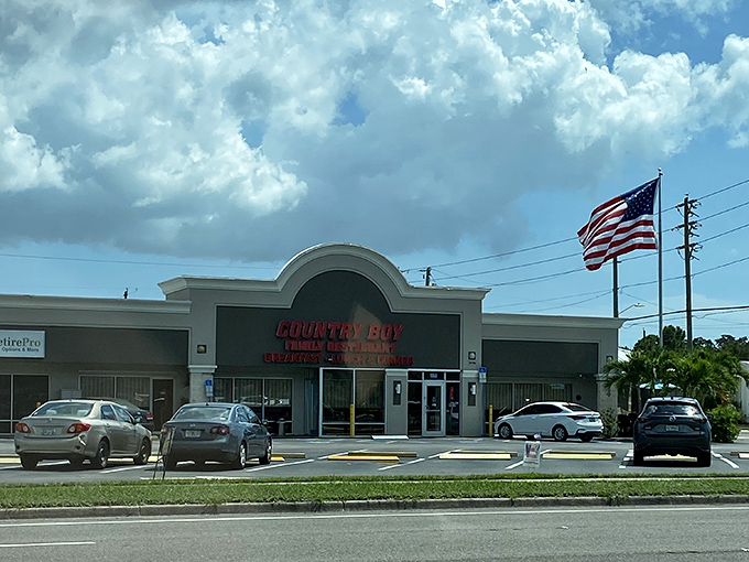 An American flag waves proudly outside Country Boy Restaurant, as if to say "this is where real American breakfast happens."