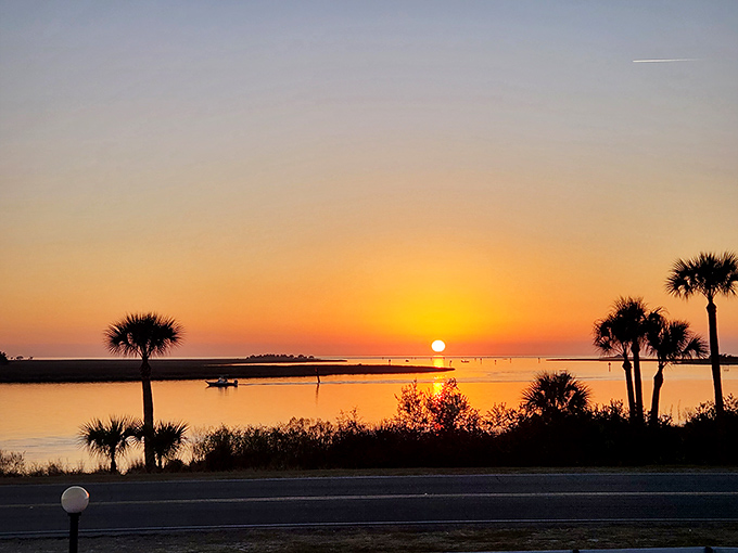 Sunset paints the Gulf horizon in impossible oranges and pinks, nature's perfect finale to a day in Florida's forgotten coast.