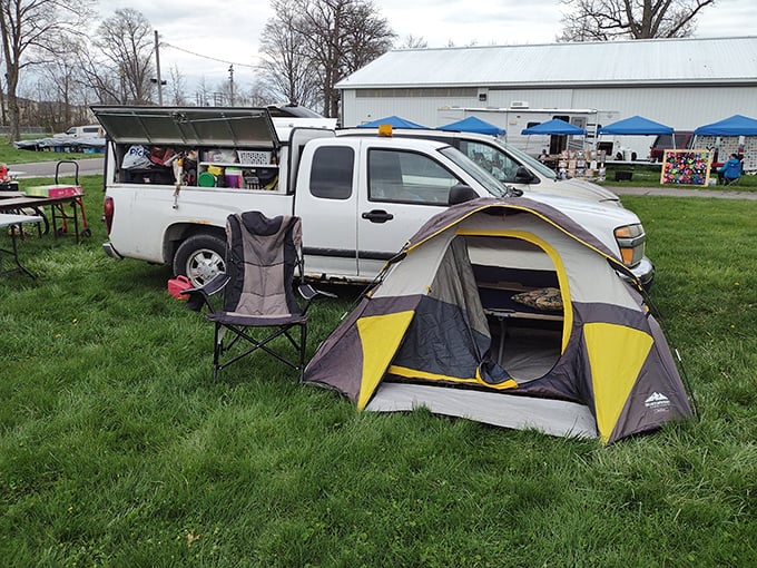 The dedicated vendor's temporary home&mdash;complete with tent and folding chair&mdash;proves that at Tiffin, the early bird not only gets the worm but also the prime selling spot.
