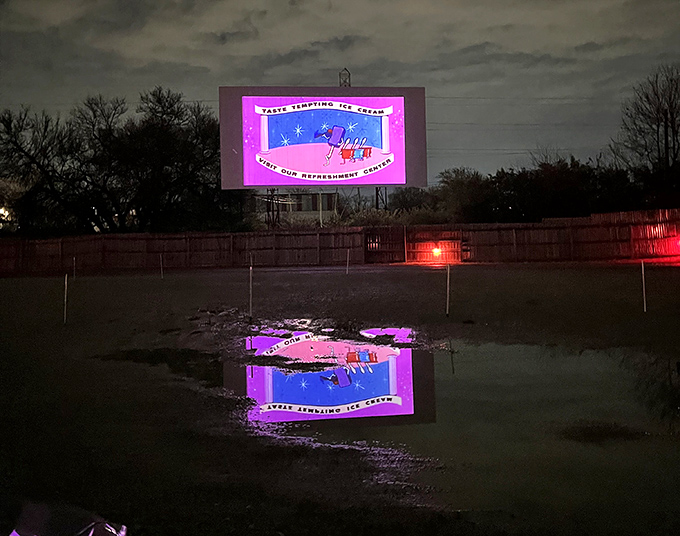 As darkness falls, the screen illuminates with vintage intermission animations. "Let's all go to the lobby" never looked so magical.