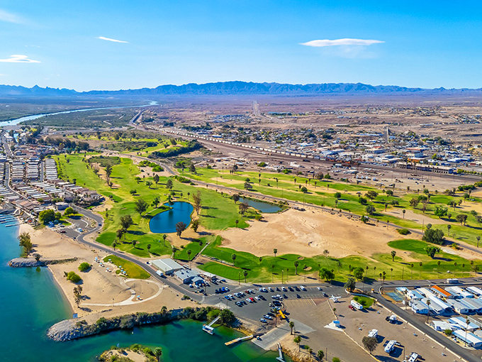 From above, Needles reveals its true oasis character&mdash;a green golf course and blue waters carving life into the desert landscape. Nature's most dramatic before-and-after picture.
