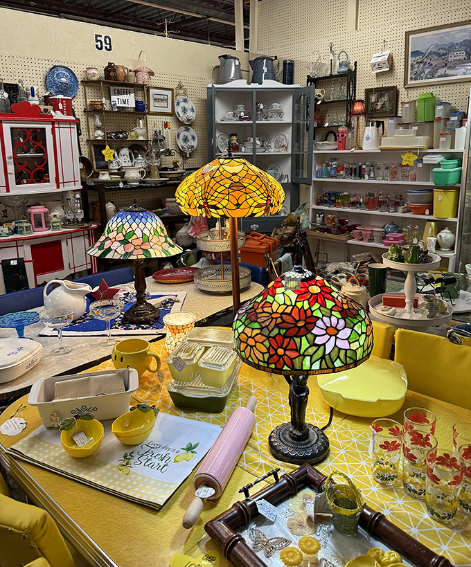 Tiffany-style lamps cast their kaleidoscope glow over a treasure trove of kitchenware that would make any vintage collector swoon.