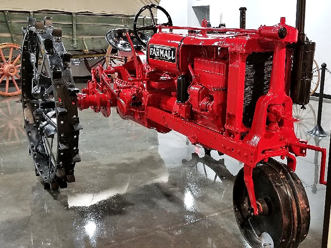 The gleaming red vintage Farmall tractor stands as a monument to American agriculture. Farm equipment has never looked so ready for its close-up.