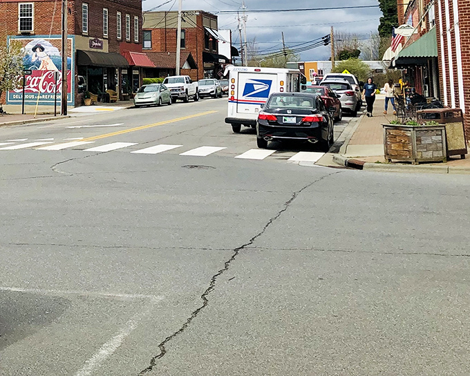 Main Street magic unfolds where brick buildings hold decades of stories and every storefront whispers "slow down, friend."