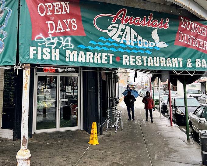 That green awning beckons like a lighthouse to seafood lovers navigating South Philly's Italian Market treasures.