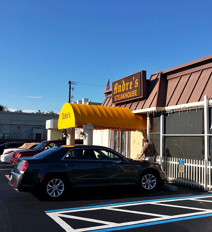 Andre's bright yellow awning is like a beacon for steak lovers, promising old-school charm and sizzling perfection inside.