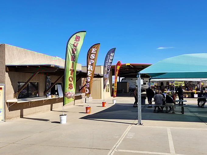 Colorful flags welcome bargain hunters to Arizona Market Place, where "burritos" and "coffee" promises fuel your treasure hunting adventures.