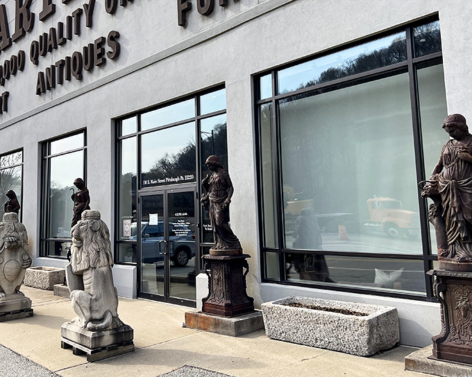 Statues standing guard outside Artifacts like ancient sentinels, promising treasures within that span centuries of human creativity.