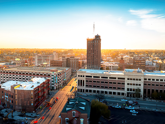 Aurora's skyline glows at sunset, showcasing the city's blend of historic charm and modern development where affordable homes await.