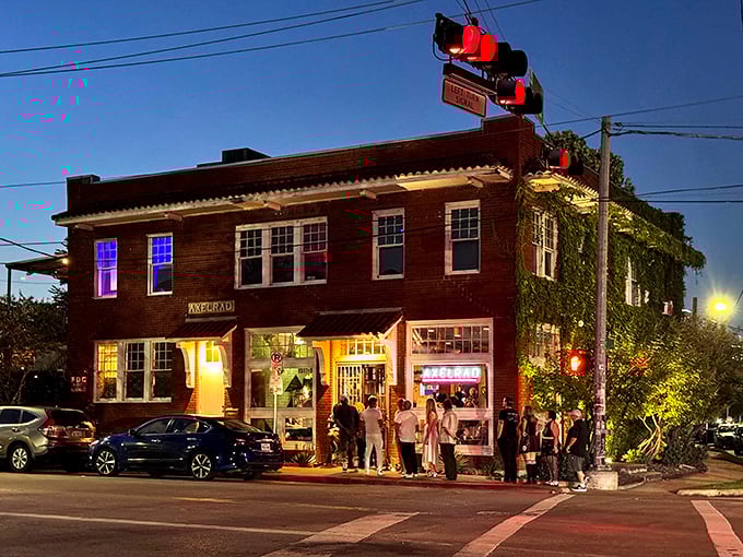 Axelrad's brick facade glows with promise at dusk, a beacon for Houston's thirsty souls seeking community under the stars.