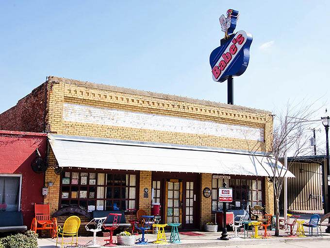 That vintage neon sign and colorful patio furniture whisper "come sit a spell" in true Texas style.