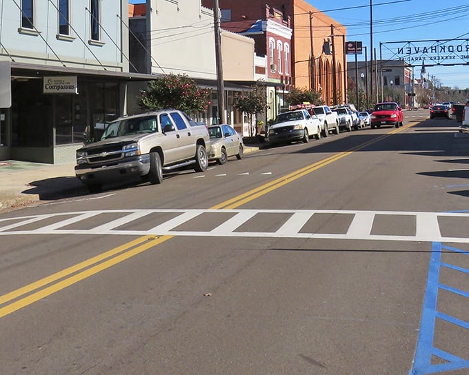 Main Street magic where pickup trucks park like they own the place and crosswalks actually mean something.