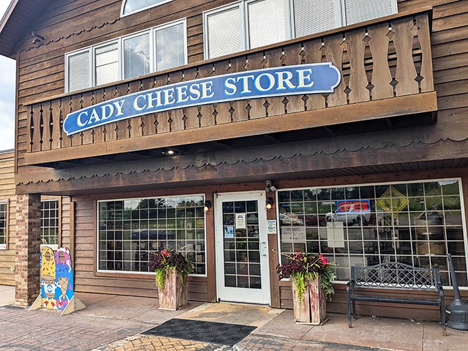 The rustic wooden charm of Cady Cheese Store beckons cheese lovers like a dairy siren song.