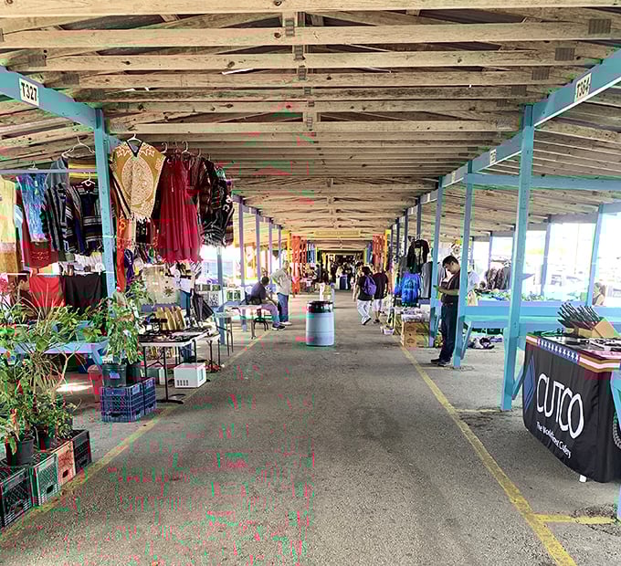 The covered walkways of Bussey's Flea Market stretch into the distance like a treasure map waiting to be explored. Every booth holds potential discoveries!