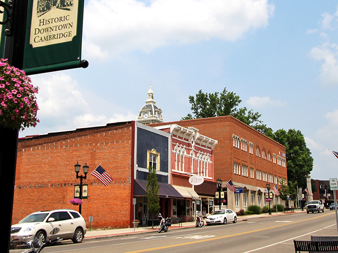Historic downtown Cambridge welcomes you with brick buildings and American flags, where small-town charm meets big-hearted hospitality.