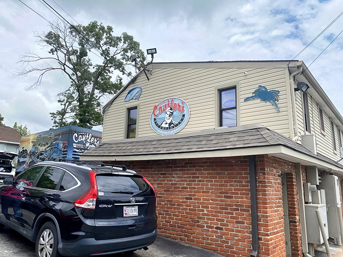 That weathered siding and crab logo tell you everything - this is where locals come for serious seafood business.