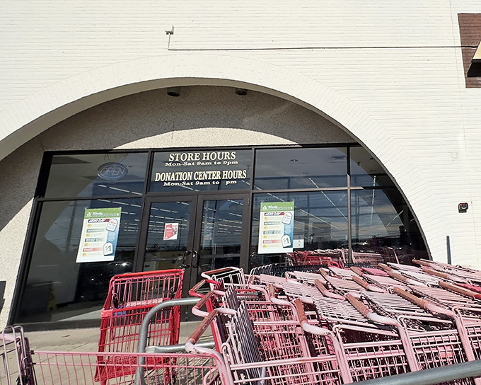 The entrance to CommunityAid beckons with rows of shopping carts standing ready. Like a treasure hunt starting line, just waiting for eager bargain hunters.