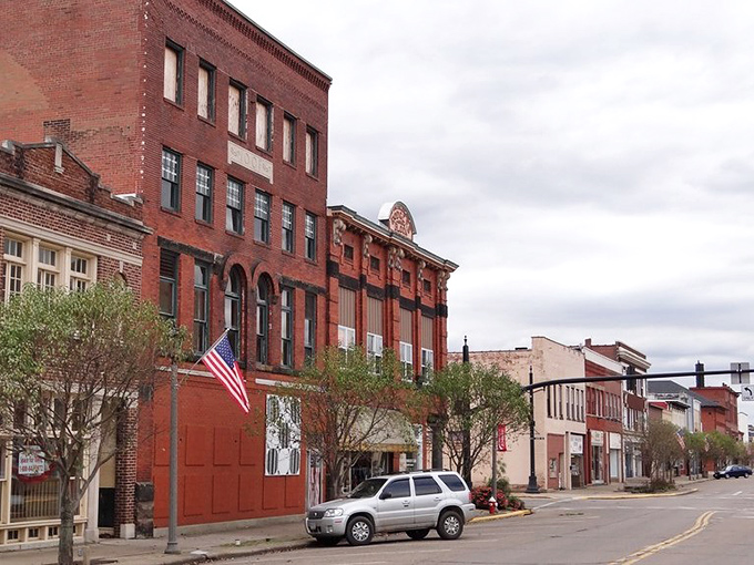 Classic brick storefronts line this charming street where every dollar stretches like taffy at a county fair.