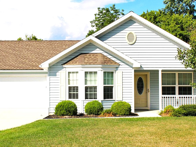 Look at that porch! Perfect for morning coffee and watching the world go by.