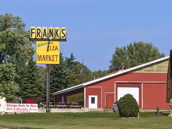 Frank's red barn stands like a beacon for bargain hunters, promising treasures inside.