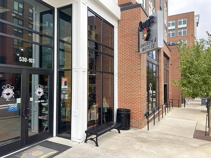 Dame's modern brick facade promises comfort food classics in downtown Durham's bustling heart.