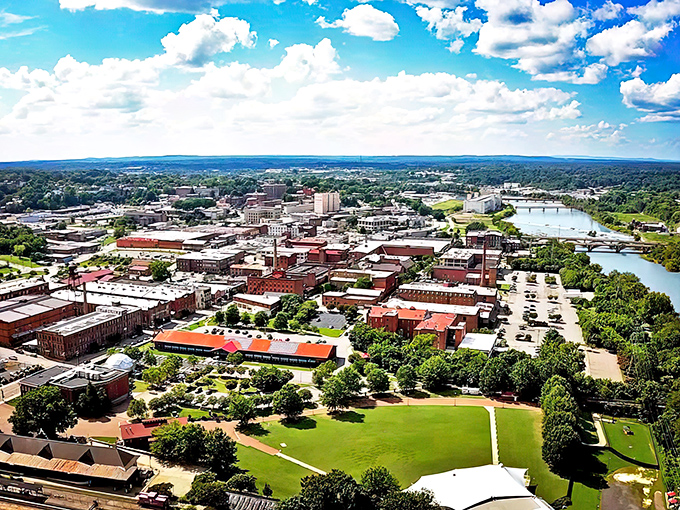 Danville from above: where brick-red history meets emerald parks and a river that whispers, "Come sit a while, friend."