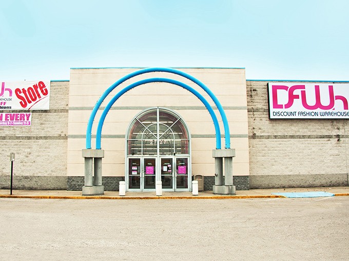 That distinctive blue archway beckons like a portal to bargain paradise - fashion treasures await inside.