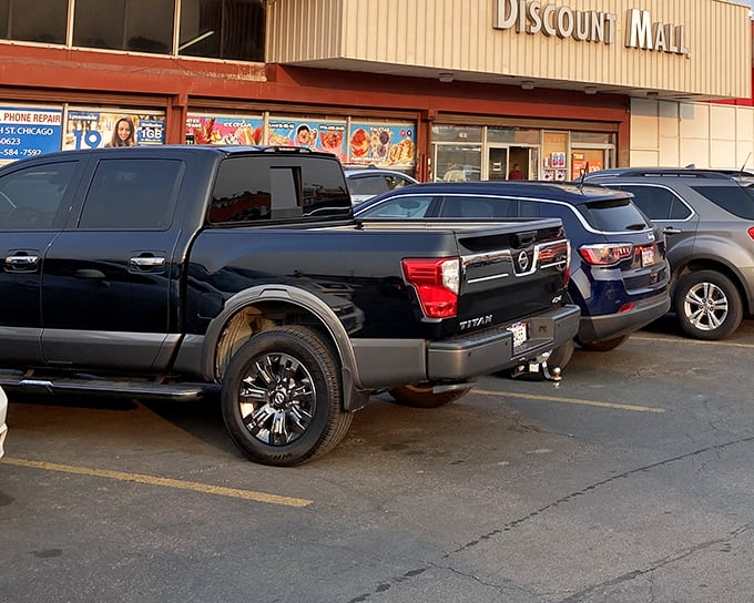 The parking lot at Discount Mall tells the whole story - when bargain hunters fill every spot, you know you've found gold.