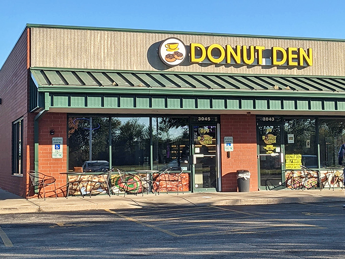 That cheerful yellow sign promises sweet salvation - and those outdoor tables suggest lingering is encouraged.