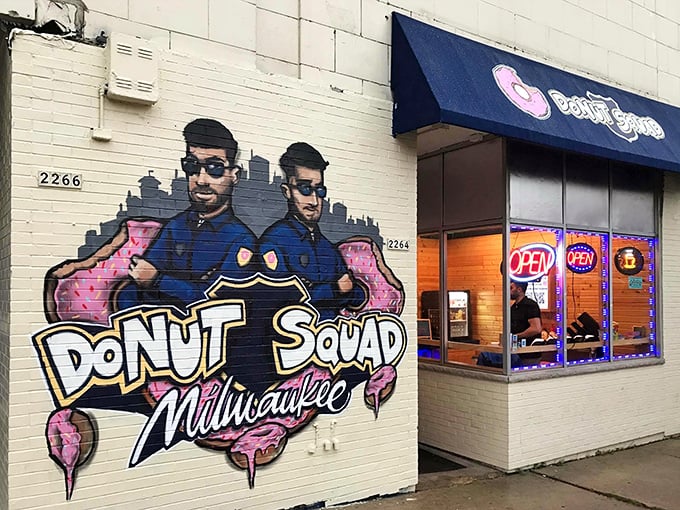 Street art meets sweet treats - this vibrant mural announces serious donut business with playful Milwaukee flair.