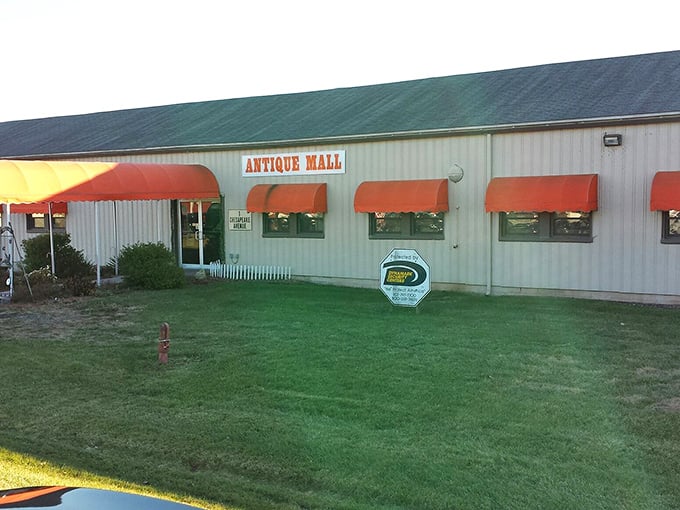 That cheerful red awning beckons like a friendly neighbor inviting you over for coffee and stories.