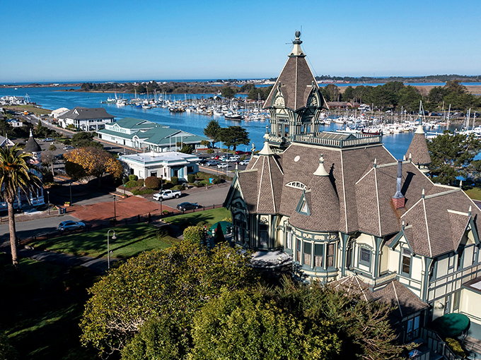 Victorian elegance meets harbor charm - Eureka's Carson Mansion stands like a purple-crowned queen overlooking Humboldt Bay's working waterfront.