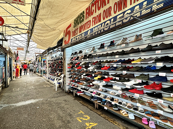 Shoes galore! This vendor's wall of footwear stretches like a rainbow of comfort and style possibilities.