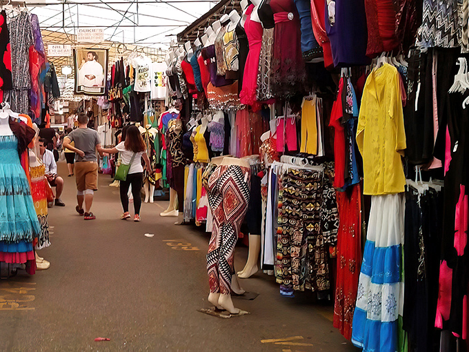 A rainbow explosion of clothing lines this bustling aisle at Fort Lauderdale Swap Shop. Treasure hunting has never been so colorful!