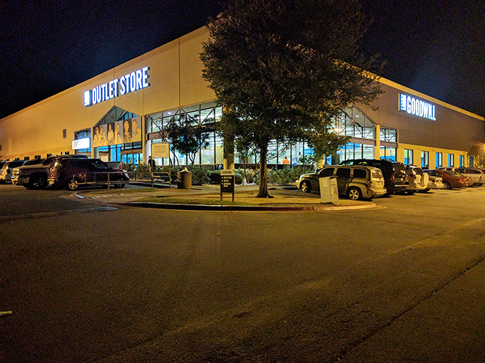 Goodwill after dark! This massive outlet store glows like a treasure chest waiting to be opened, promising bargains by the pound.