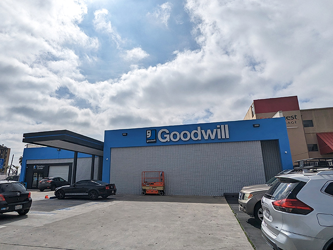 That familiar blue Goodwill sign promises treasure hunting adventures that could last from sunrise to sunset.