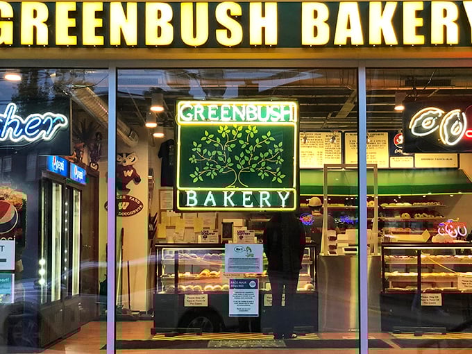 Greenbush Bakery's neon sign glows like a beacon for night owls seeking sweet salvation in Madison.