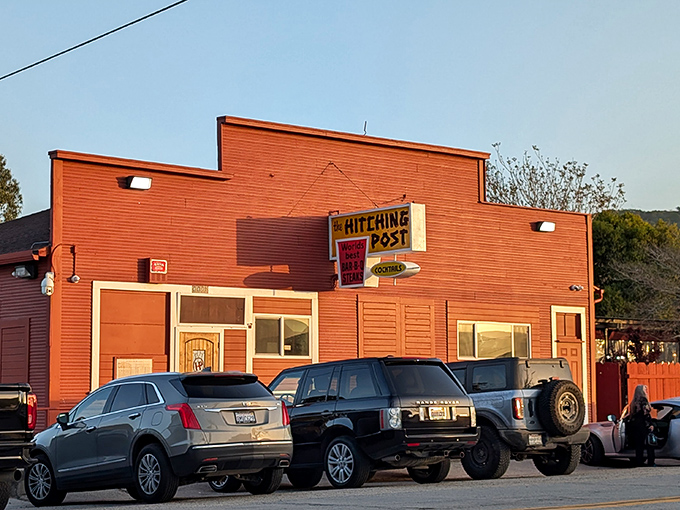 The Hitching Post's bright red exterior stands like a beacon of barbecue hope in Casmalia. Where steak dreams come true!